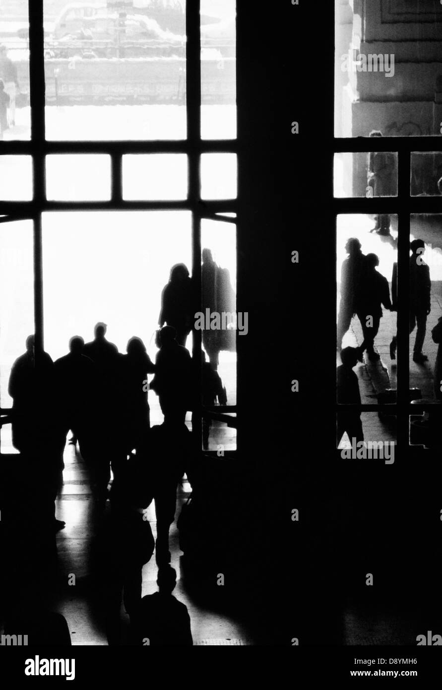 People walking in and out of building Stock Photo - Alamy
