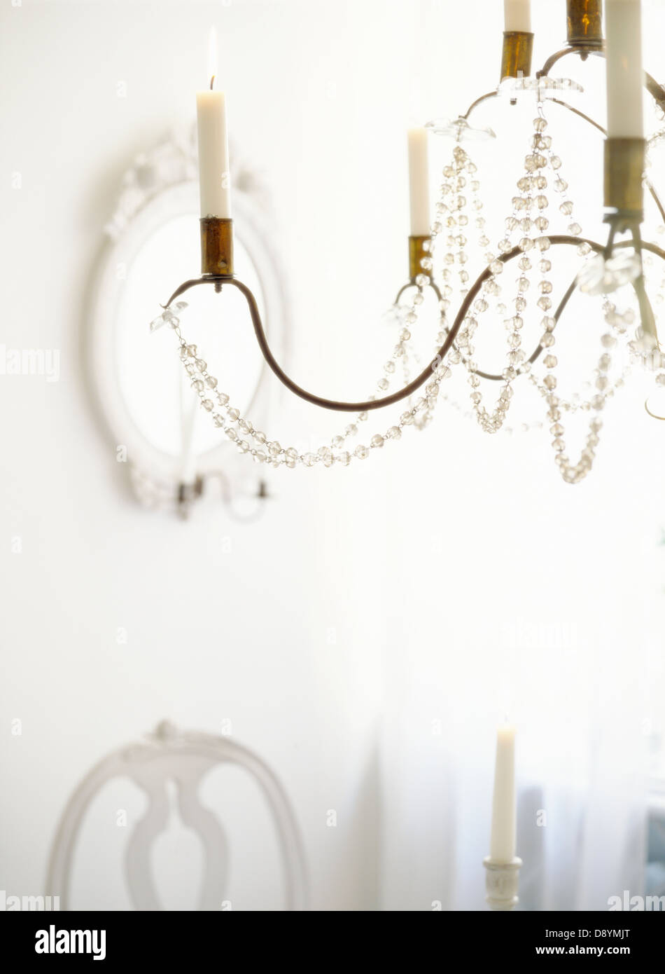 Hanging chandelier with candles Stock Photo - Alamy