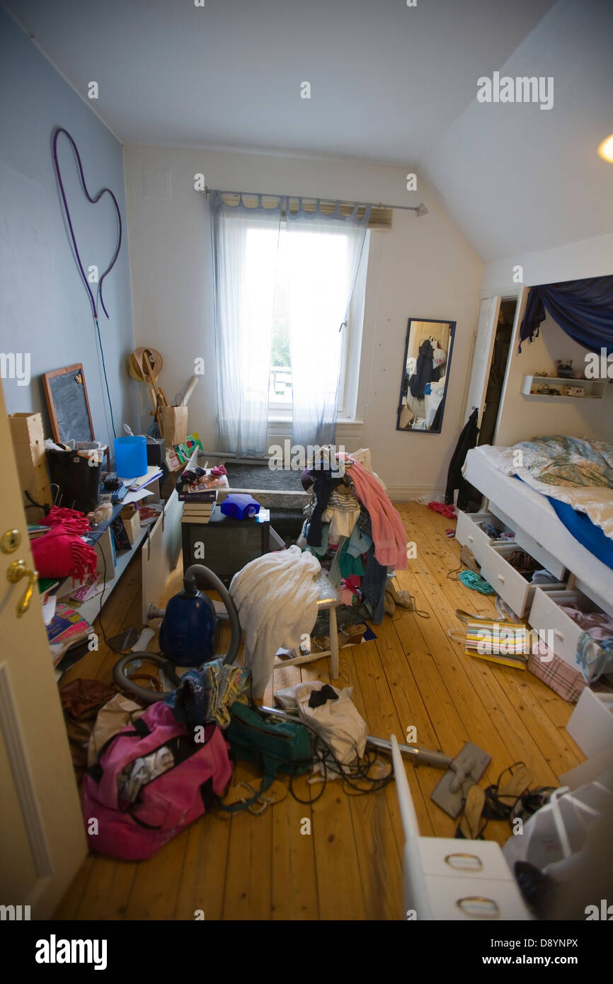 Messy bedroom with scattered items Stock Photo - Alamy