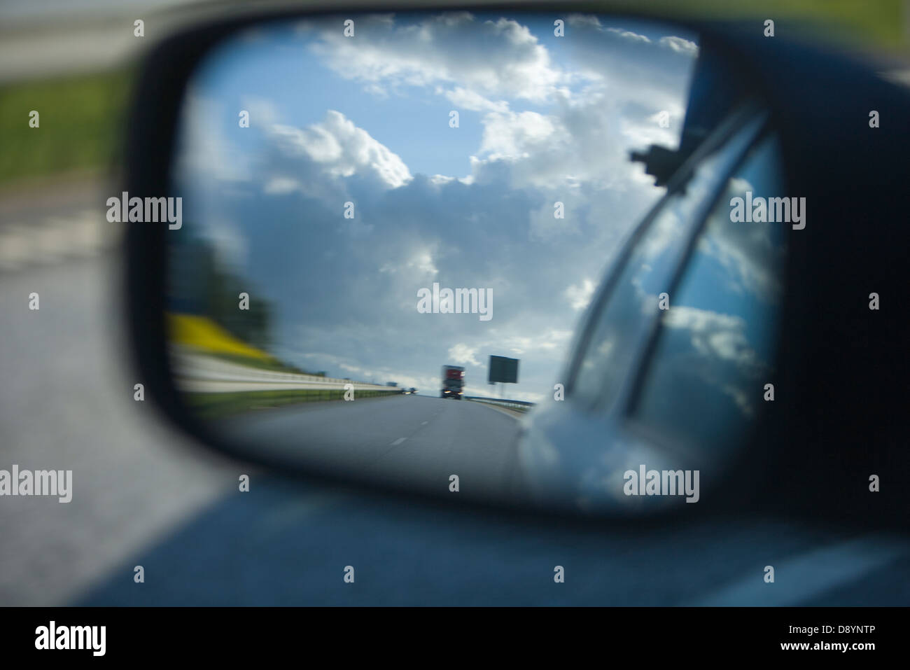 Reflection of motorway in car wing mirror Stock Photo - Alamy