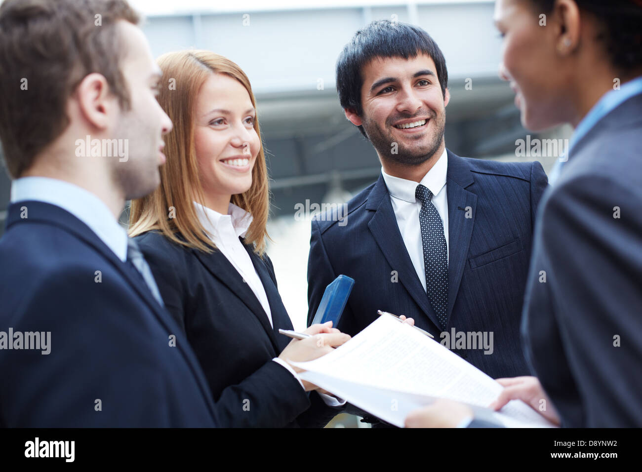 Group of business partners negotiating Stock Photo - Alamy