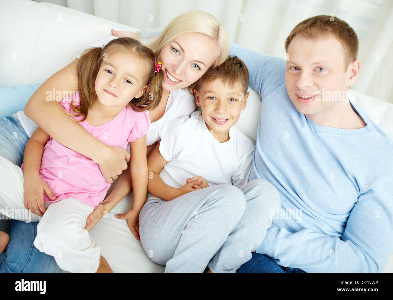 Portrait of happy family with two children looking at camera Stock ...