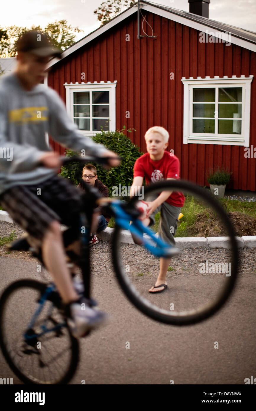 Teenagers playing outside Stock Photo - Alamy