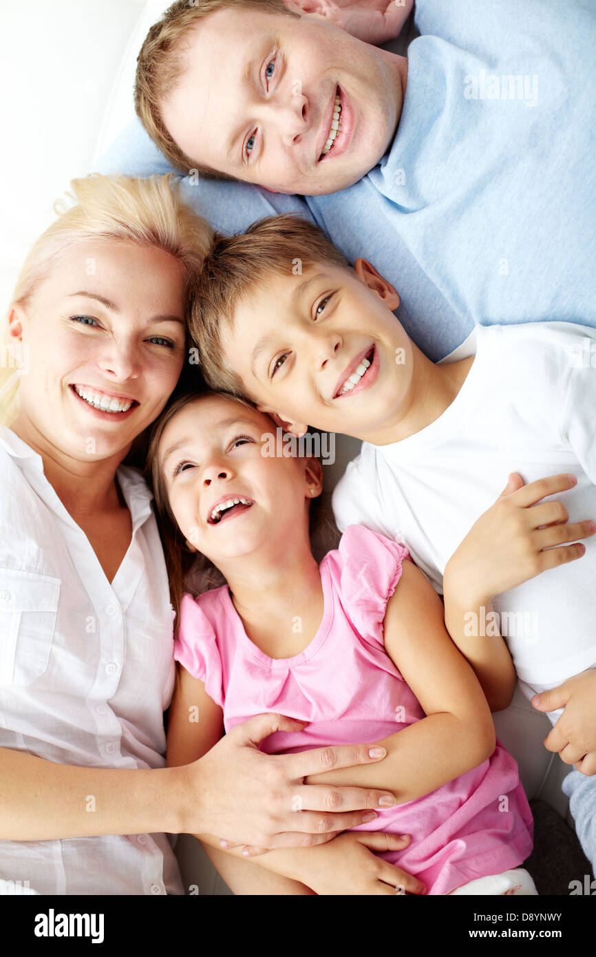 Portrait of happy family looking at camera Stock Photo - Alamy