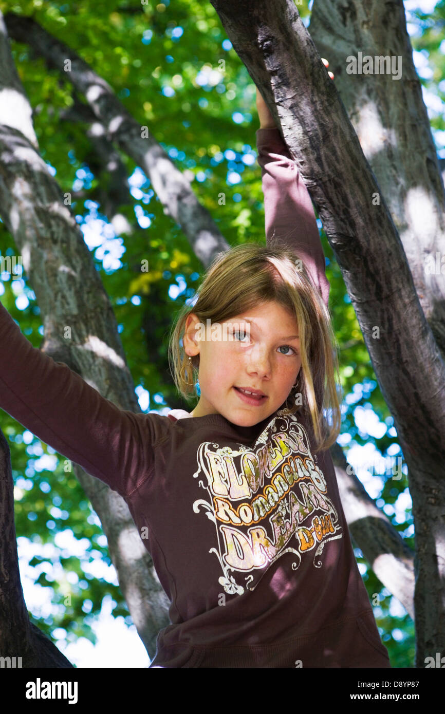 Portrait of a girl in a tree Stock Photo - Alamy