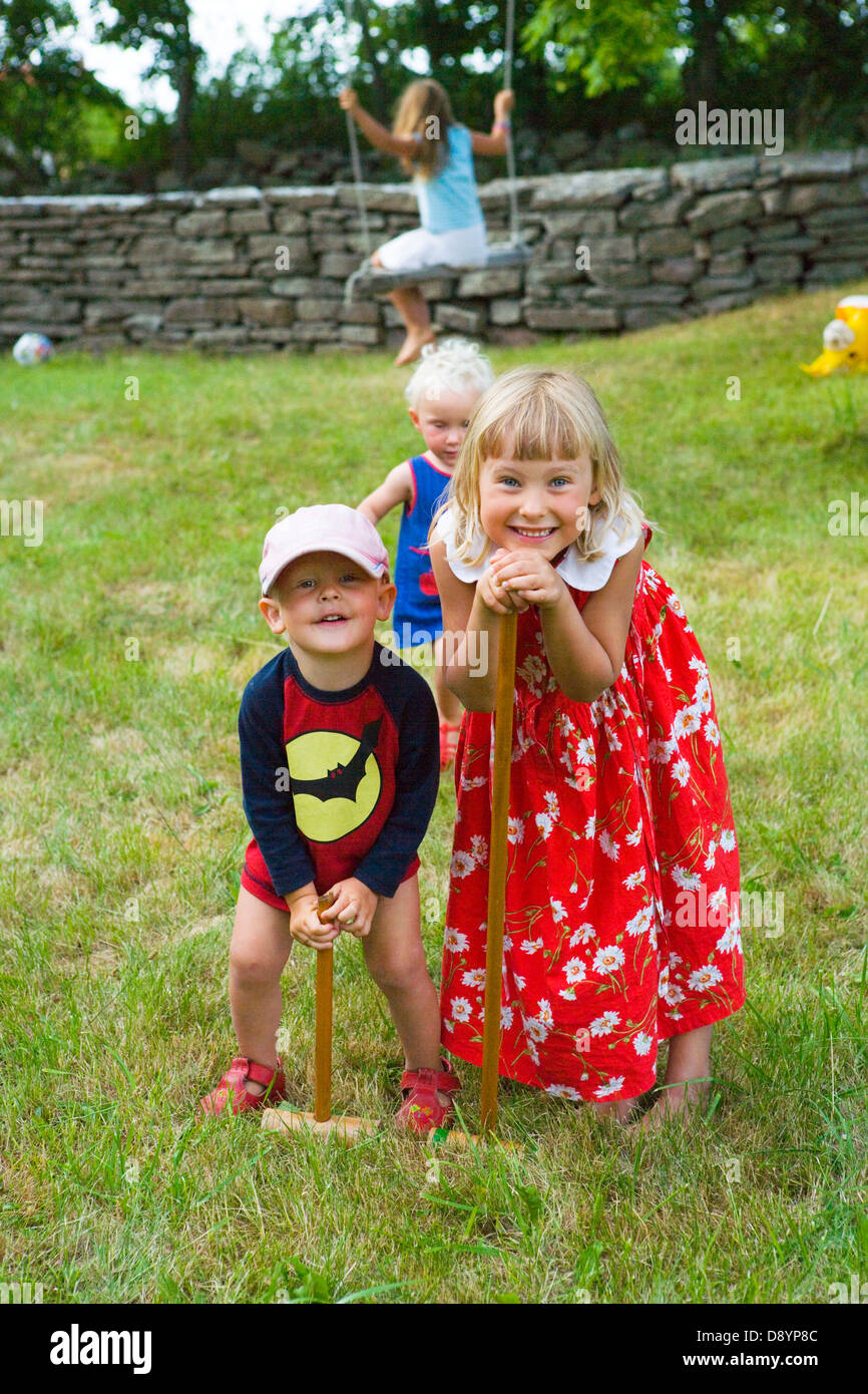 Children playing on a lawn Stock Photo - Alamy