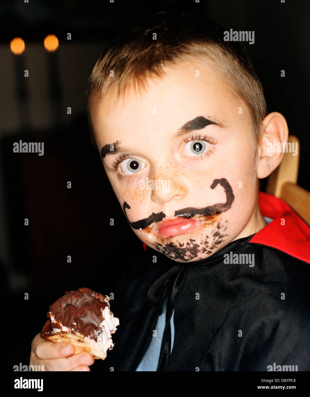A boy at a masquerade Stock Photo - Alamy