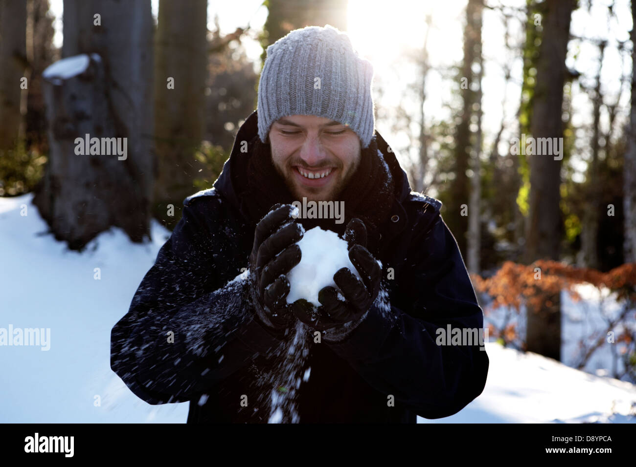 Man holding snowball Stock Photo - Alamy