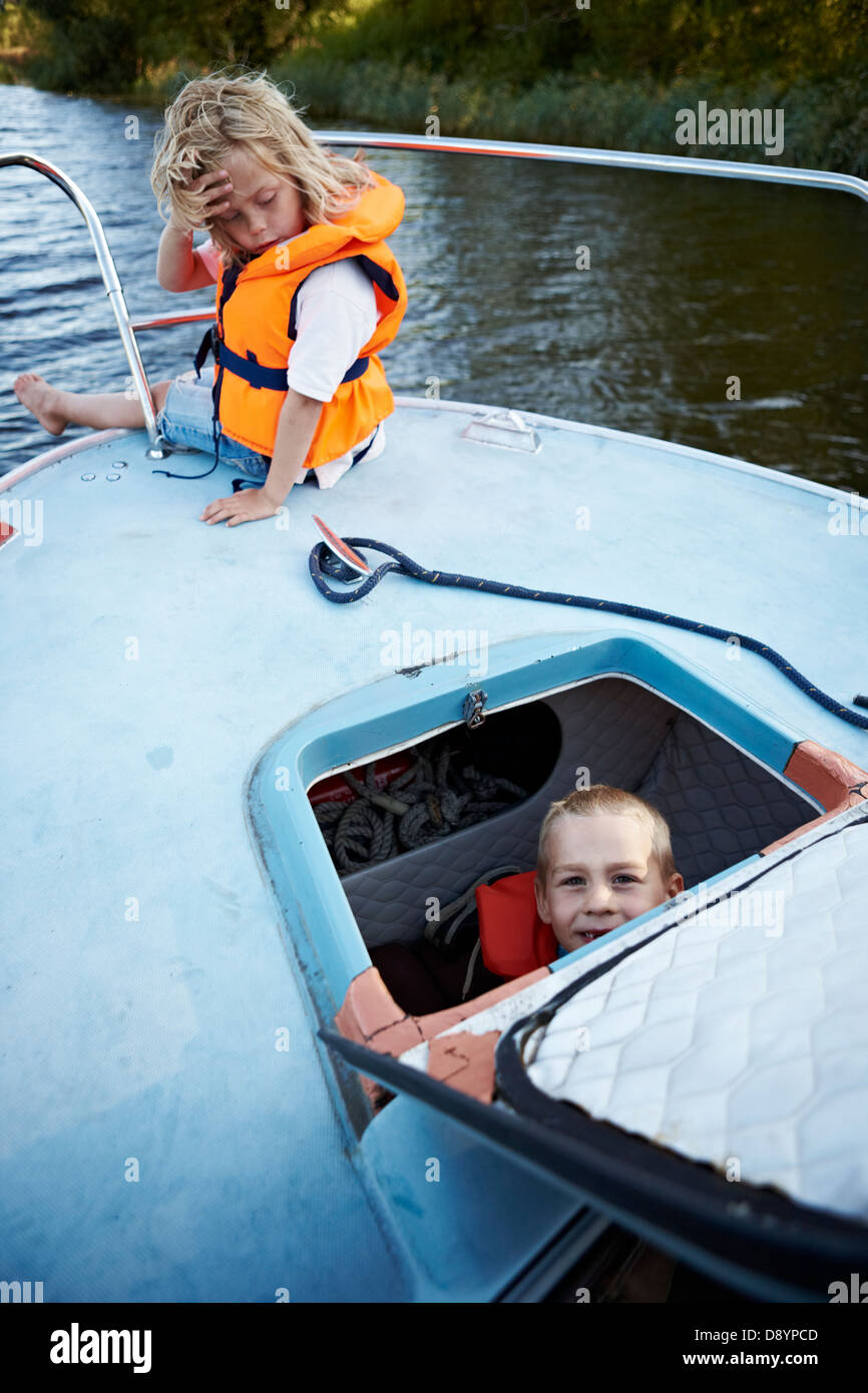 Children sitting in boat Stock Photo - Alamy