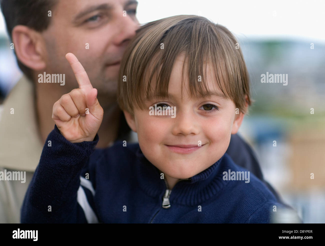 Boy with father, smiling Stock Photo - Alamy