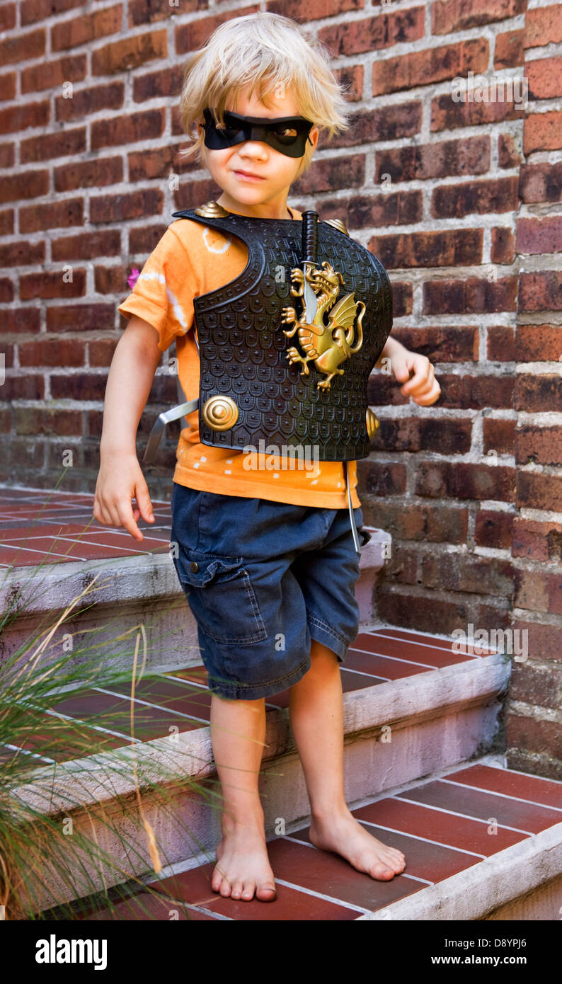 Boy wearing mask and armour Stock Photo - Alamy