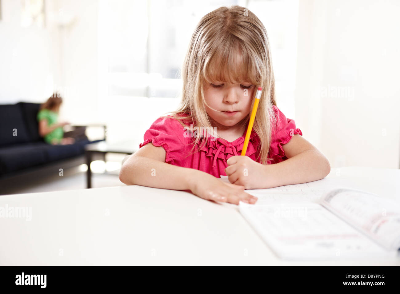 Girl doing homework Stock Photo - Alamy