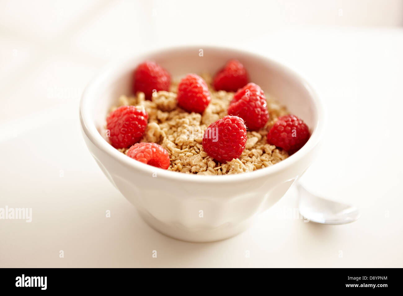 Bowl of yoghurt with raspberry Stock Photo - Alamy
