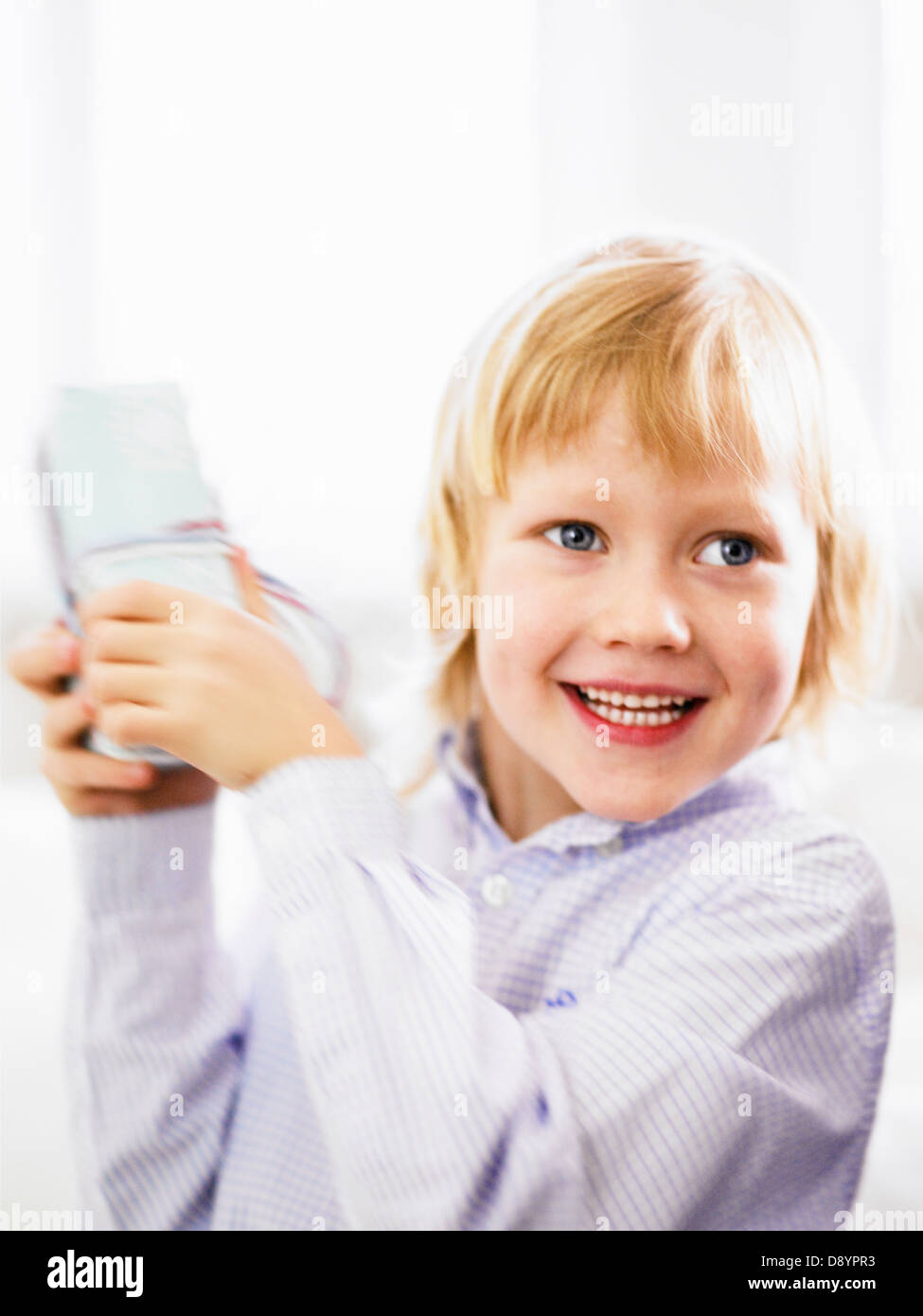 A boy with a parcel Stock Photo - Alamy