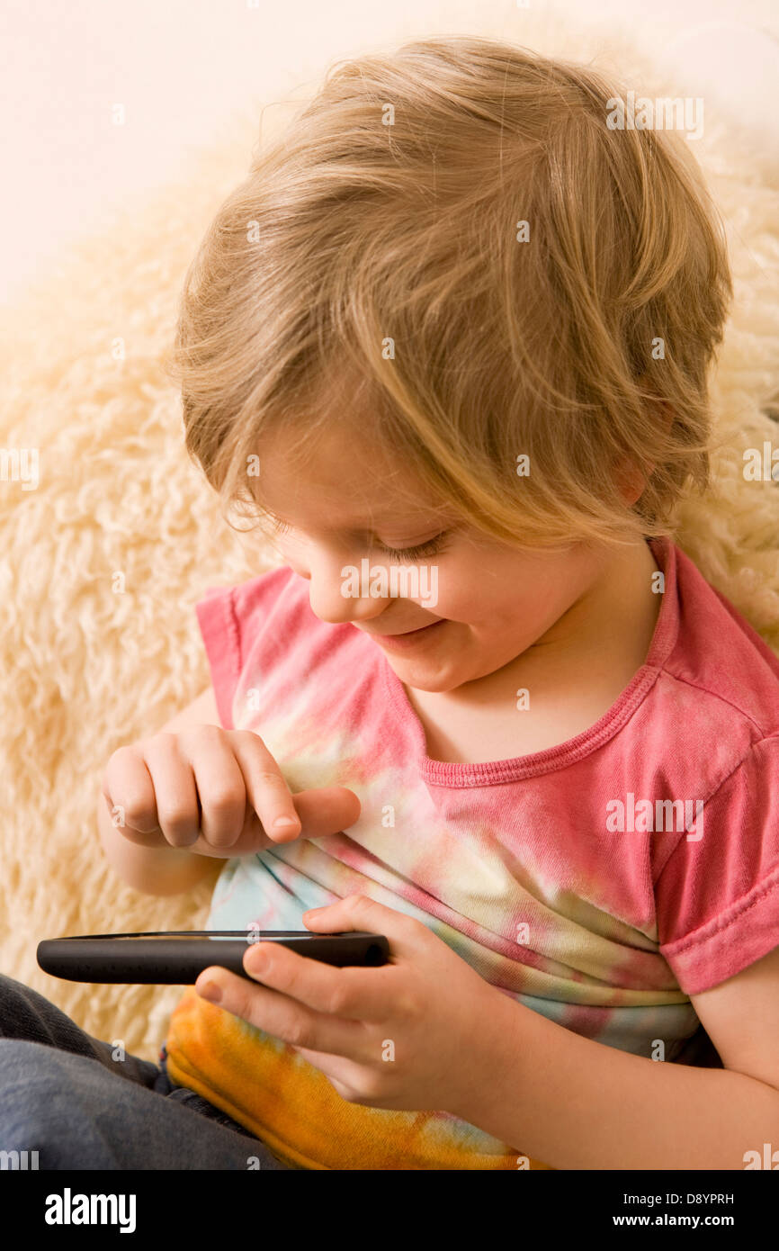 Boy playing with mobile phone Stock Photo - Alamy