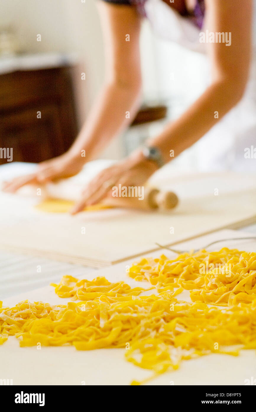 Woman preparing pasta Stock Photo - Alamy