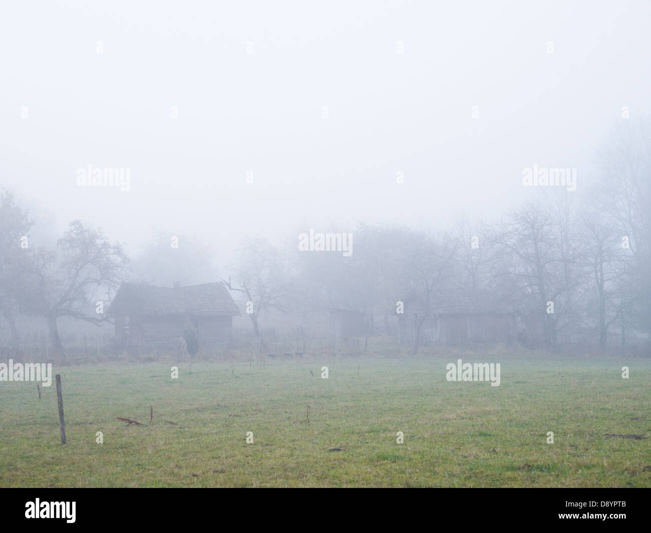 Rural scene with barn surrounded by fog Stock Photo - Alamy