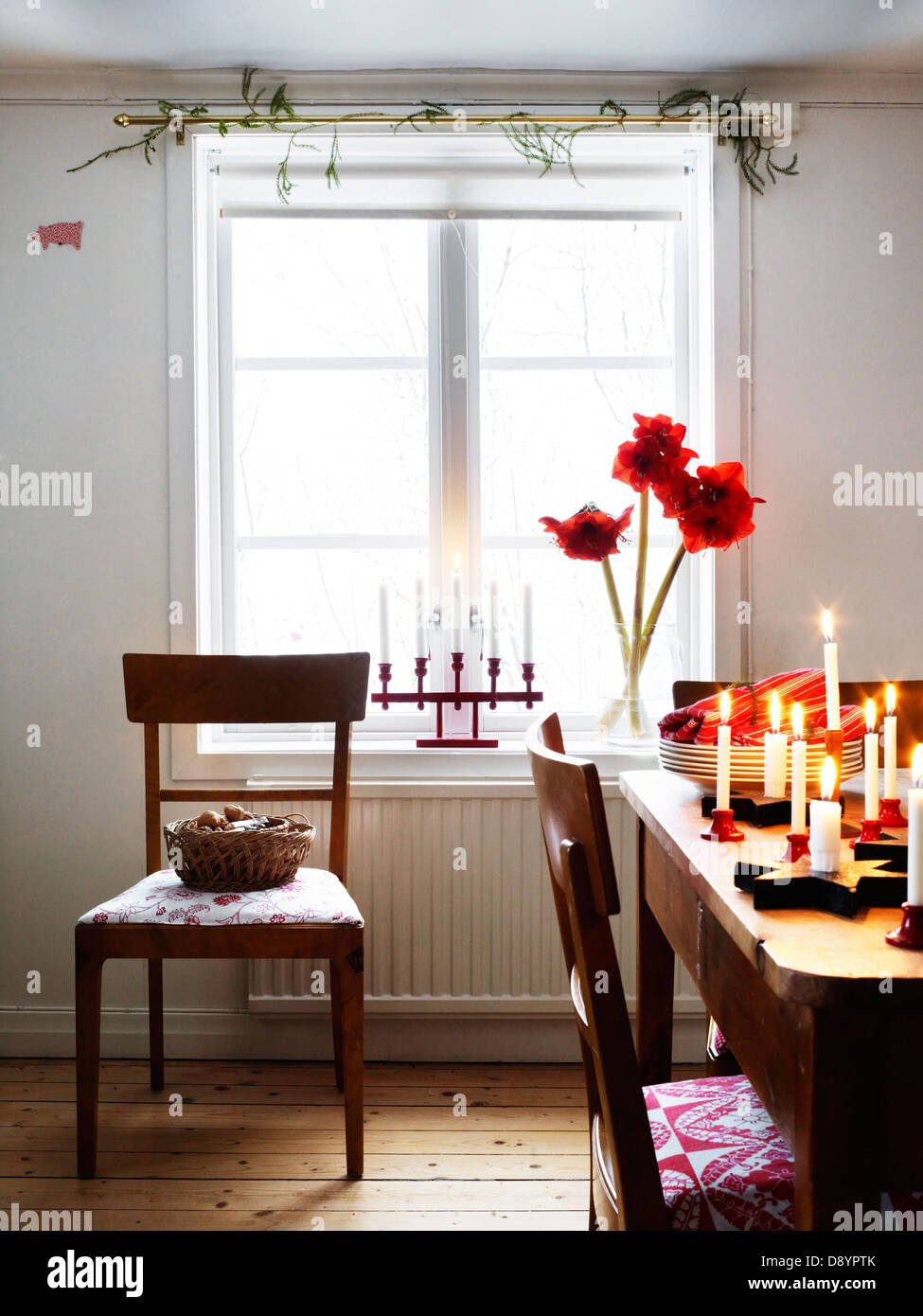 Table laid out in kitchen with candles Stock Photo - Alamy