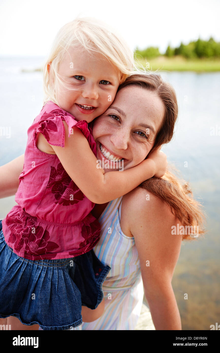 Mother and daughter hugging Stock Photo - Alamy