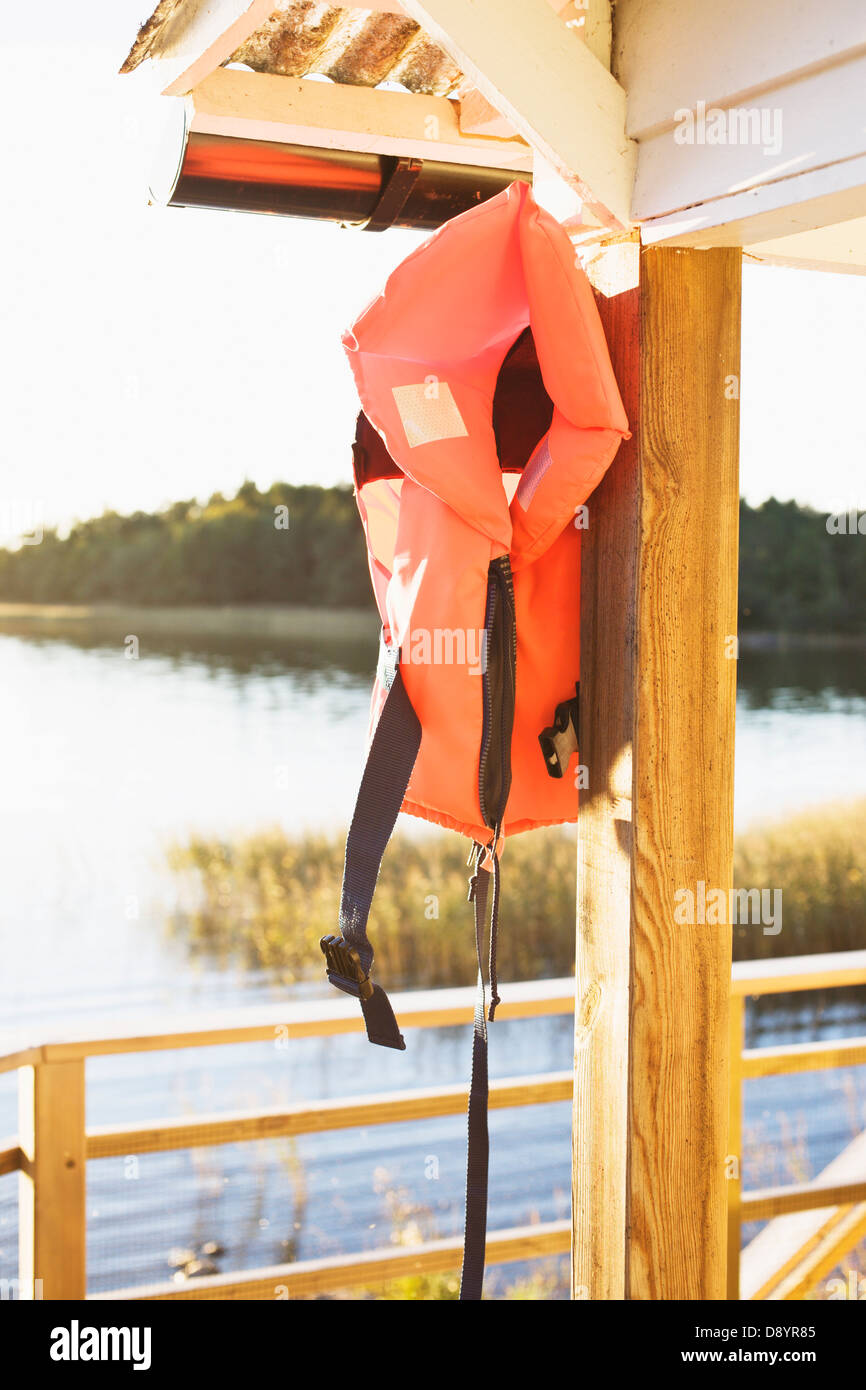 Life jacket hanging on wood Stock Photo - Alamy