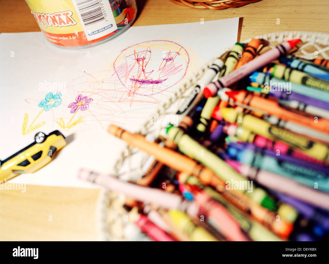 Crayons and a drawing Stock Photo - Alamy
