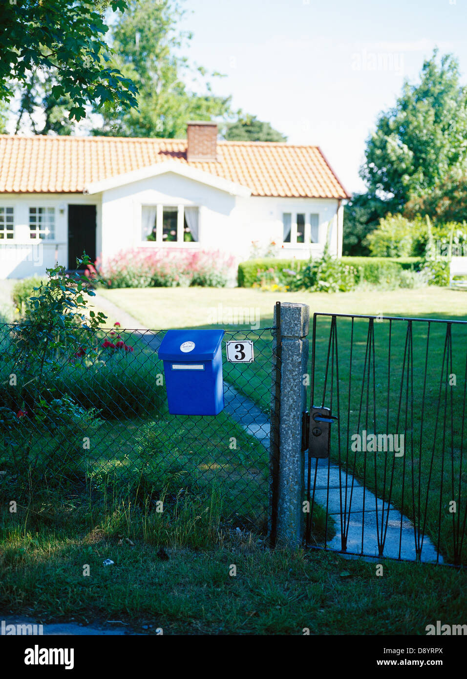 A gate in front of a house Stock Photo - Alamy