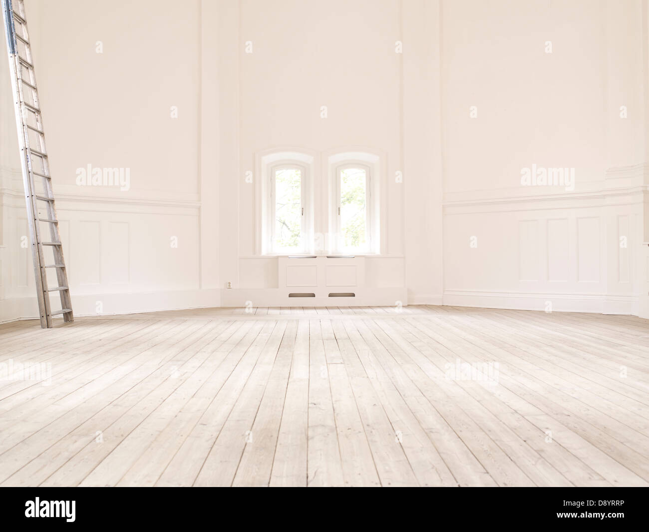 Ladder inside empty white room Stock Photo - Alamy