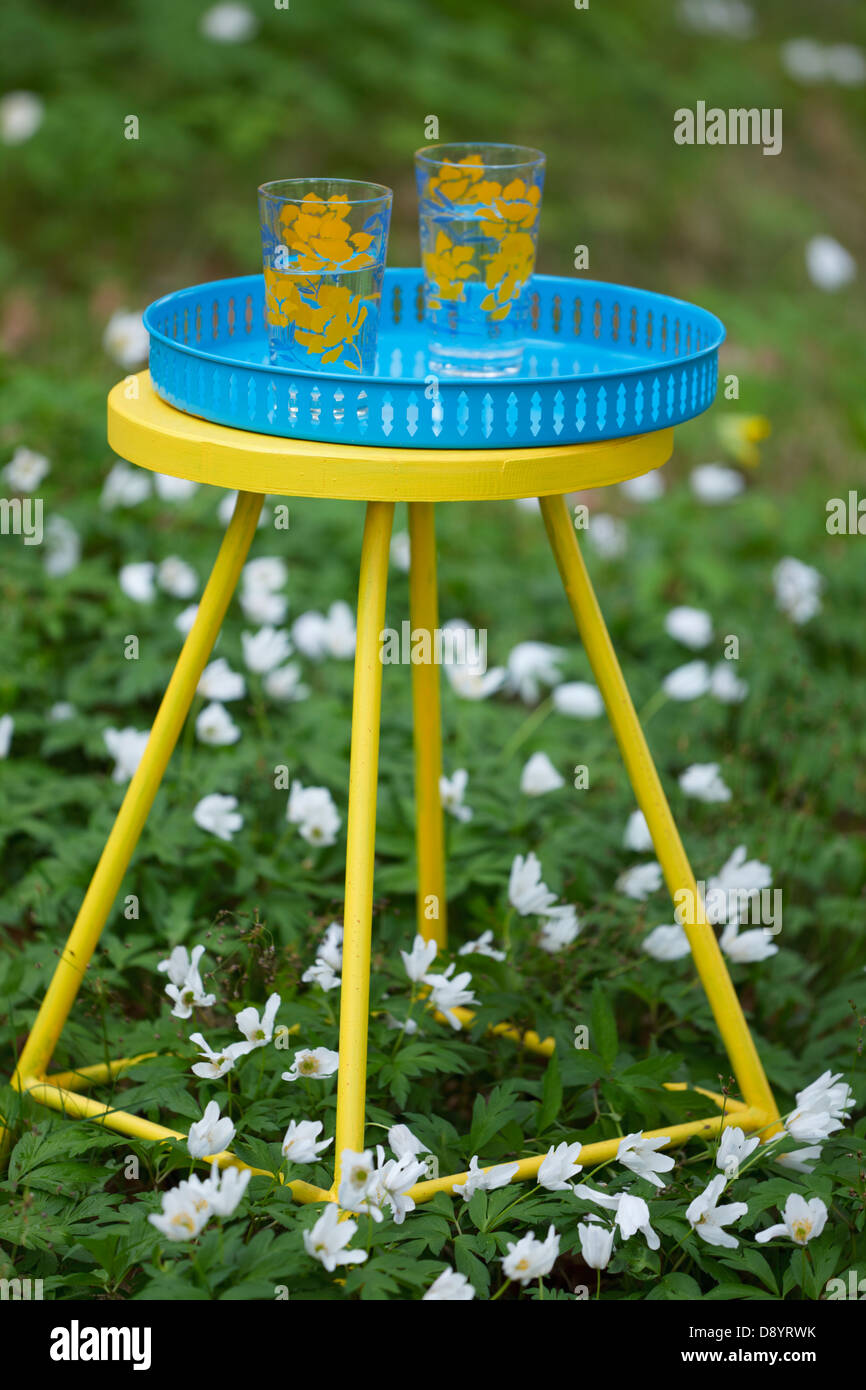 Stool with tray in meadow Stock Photo - Alamy