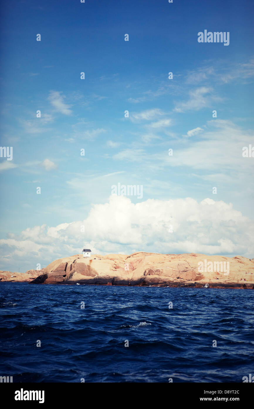 Sea coast with small house Stock Photo - Alamy