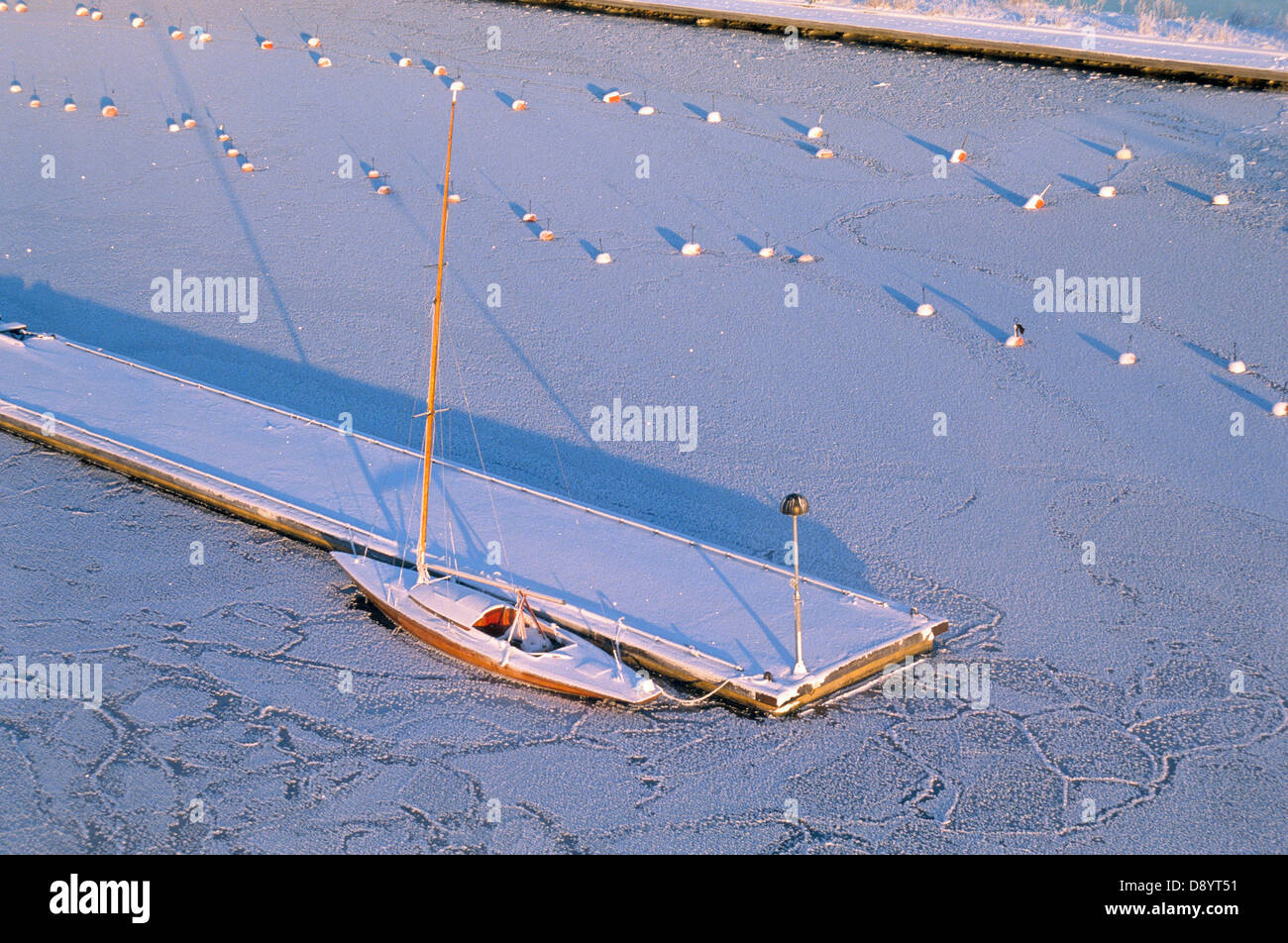 A sailing boat in a harbour during winter Stock Photo - Alamy