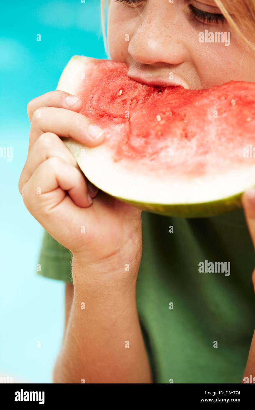 Boy eating watermelon Stock Photo - Alamy