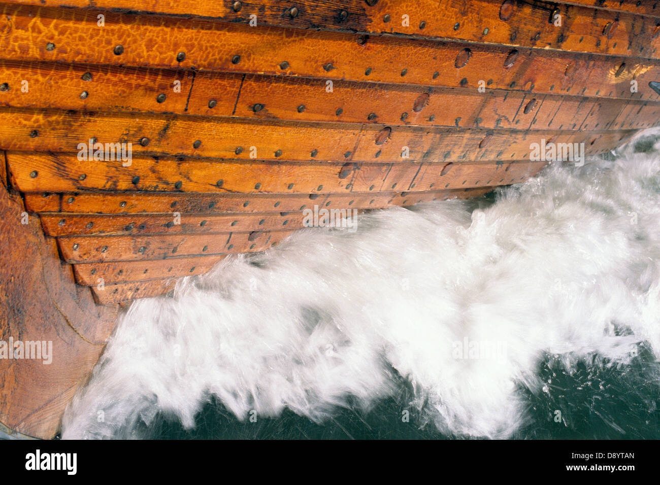 Waves by the hull of a boat Stock Photo - Alamy