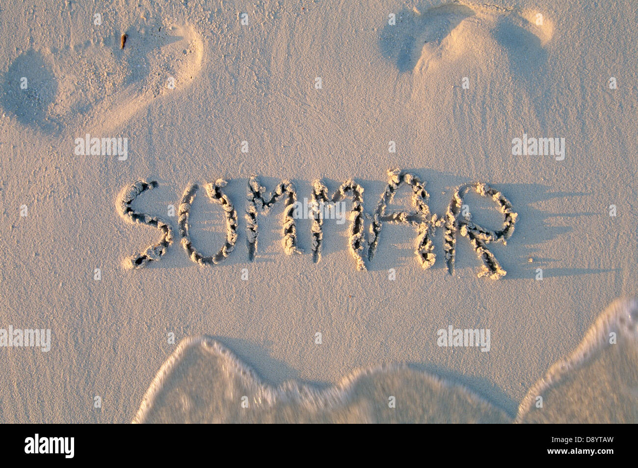 Summer written in sand Stock Photo - Alamy