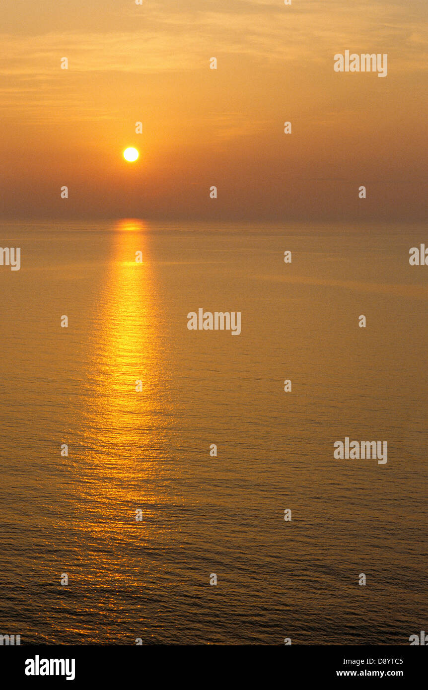 Sunset in the ocean Stock Photo - Alamy