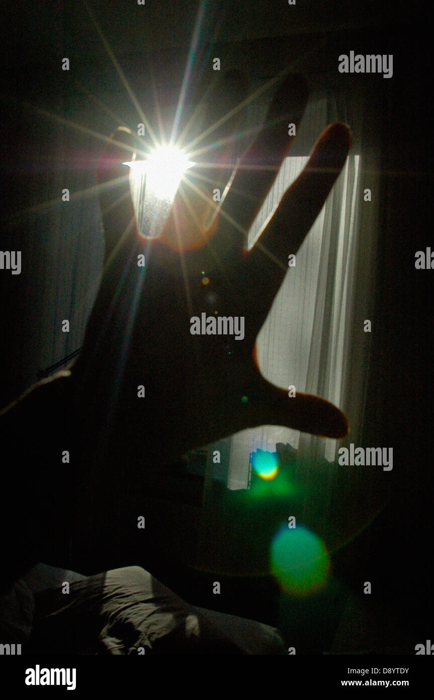 Hand blocking the sunlight Stock Photo - Alamy