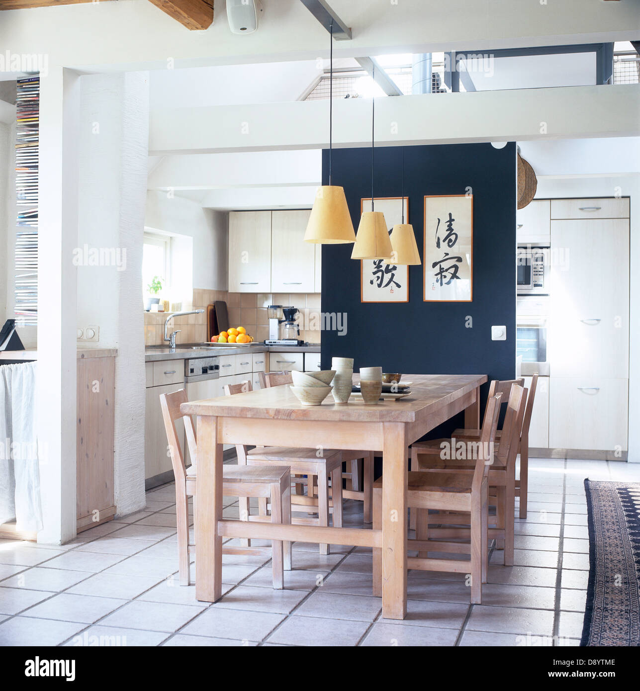 Table in a kitchen with japanese pictures Stock Photo - Alamy