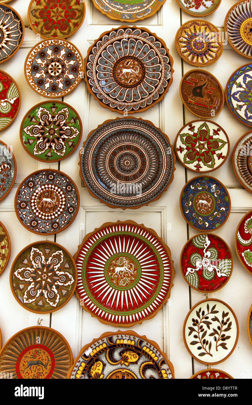 Brightly coloured ceramic plates display in a souvenir shop Stock Photo ...