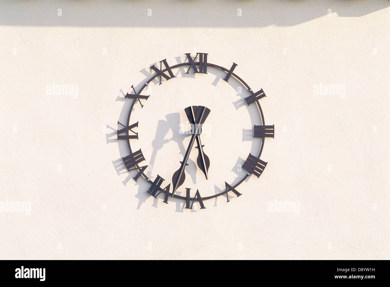 A clock on a wall Stock Photo - Alamy
