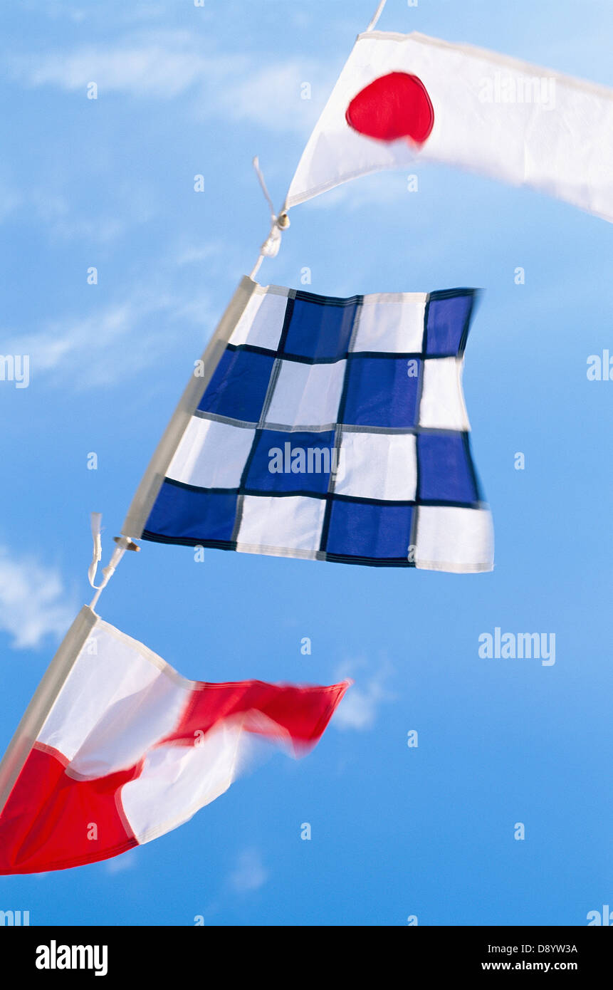 Flags with blue sky in the background Stock Photo - Alamy