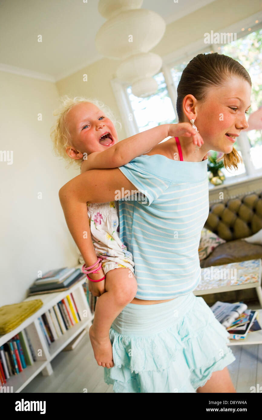 Sisters playing together Stock Photo - Alamy