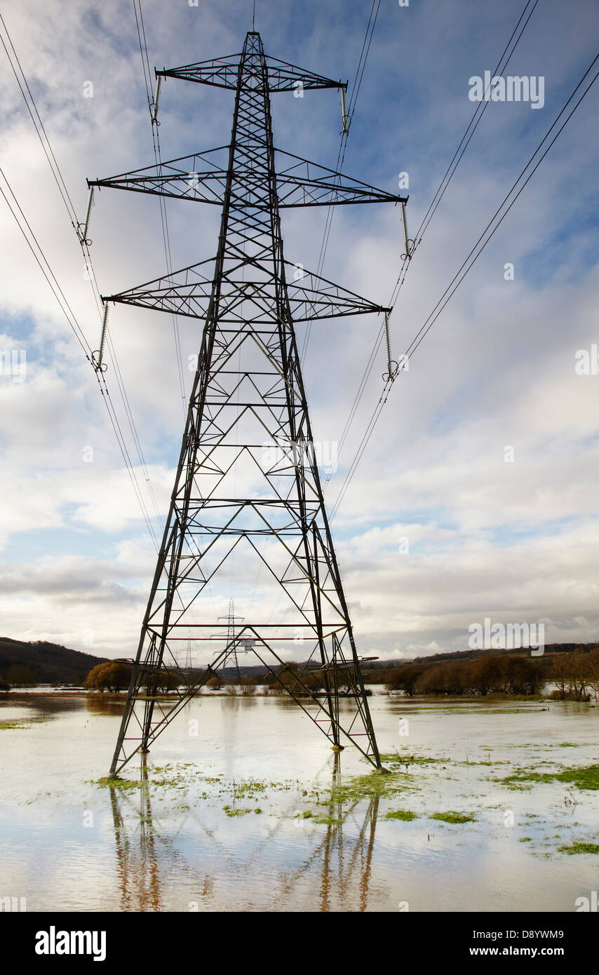 Electricity pylons standing flooded countryside in the valley of the ...