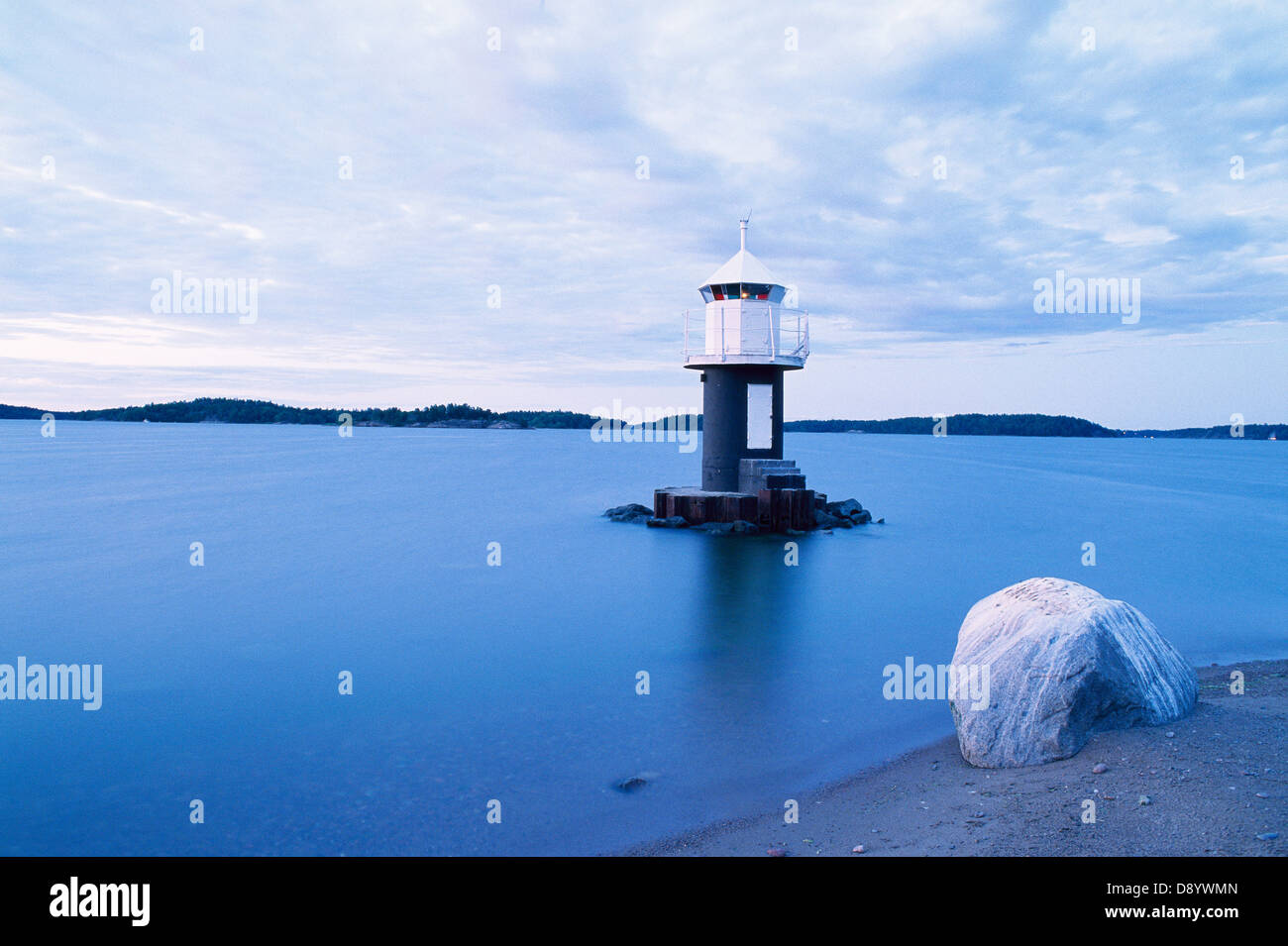 A lighthouse in blue water Stock Photo - Alamy