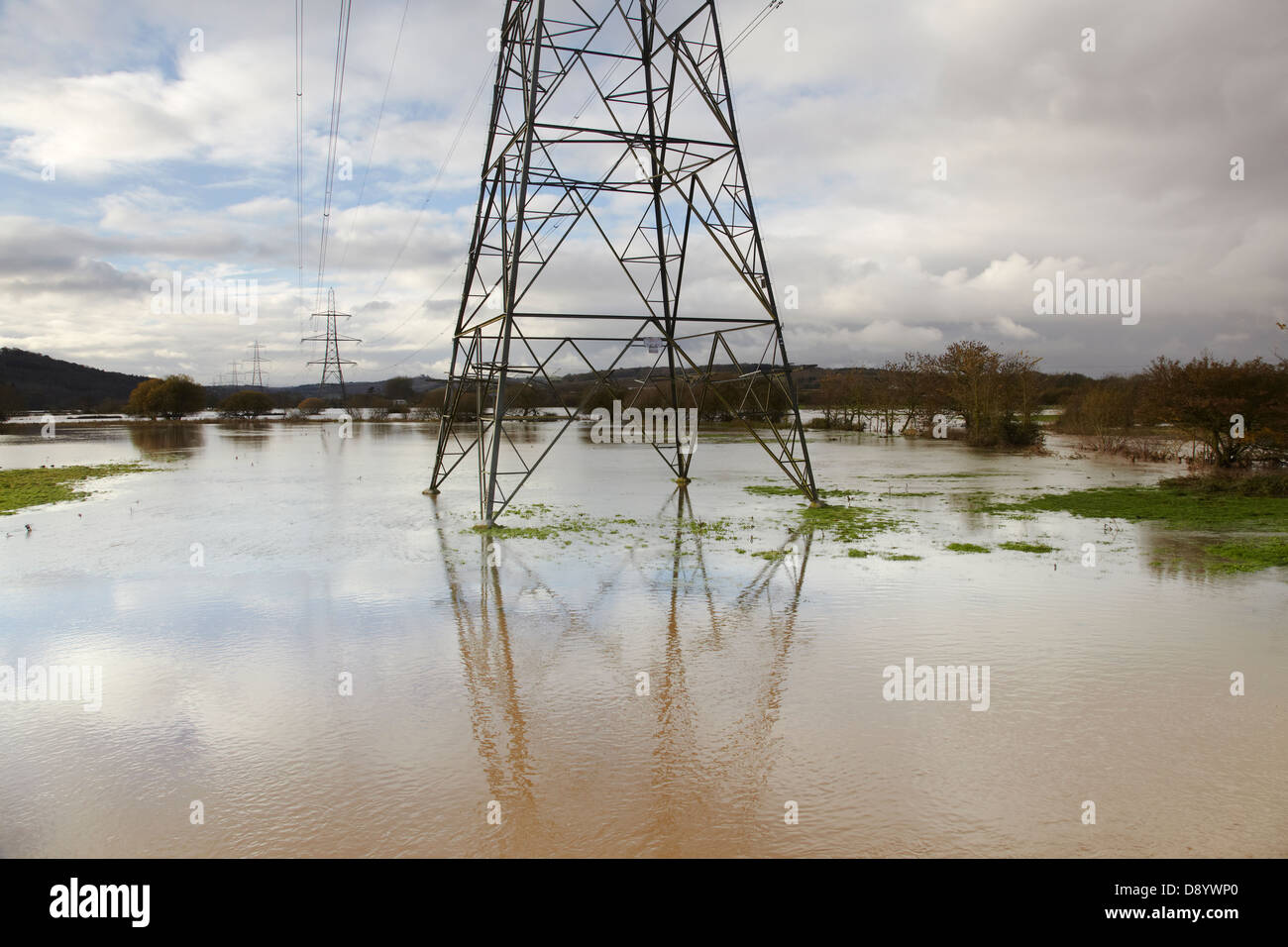 Electricity pylons standing flooded countryside in the valley of the ...