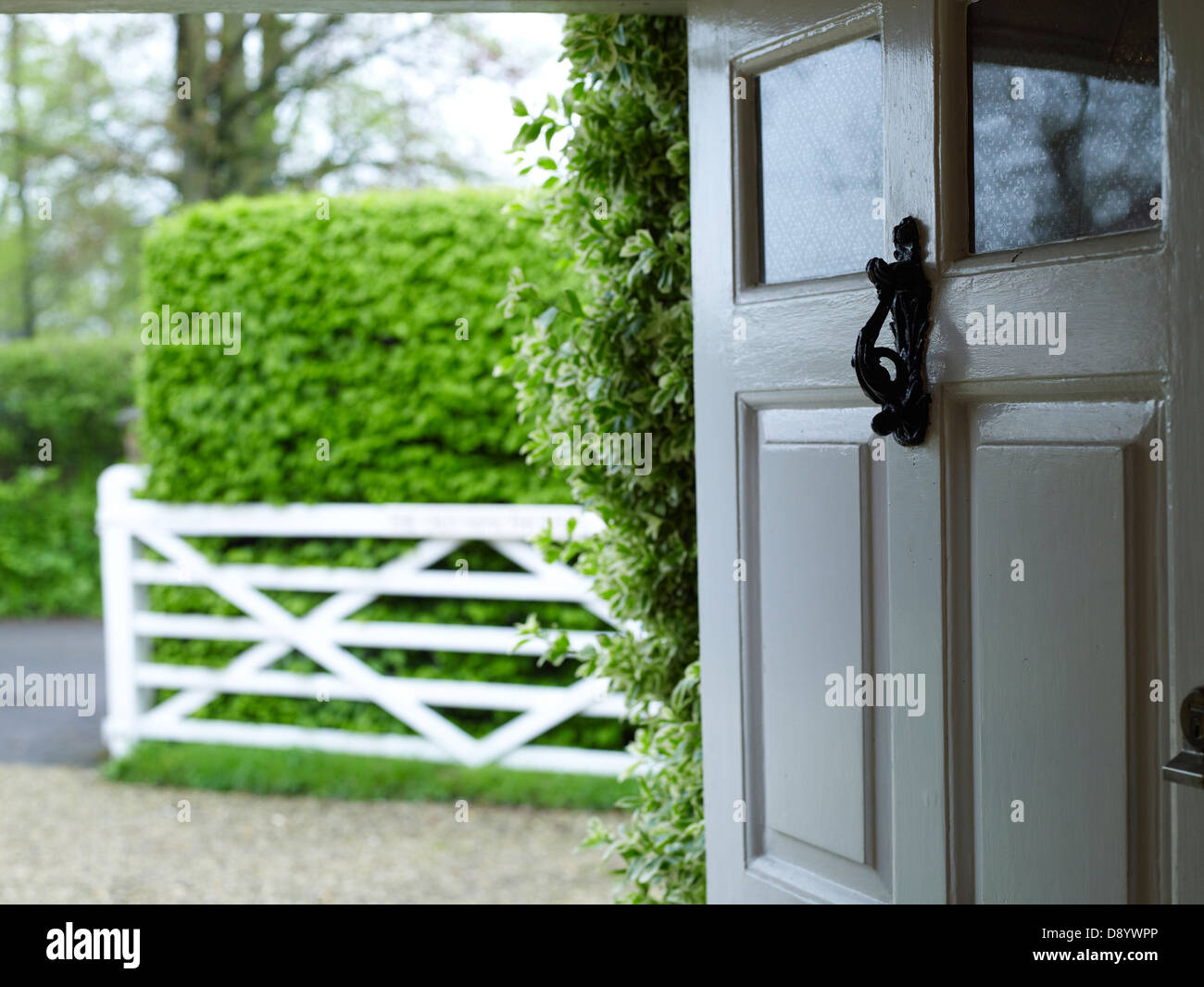 Looking out into a garden from an open door Stock Photo - Alamy