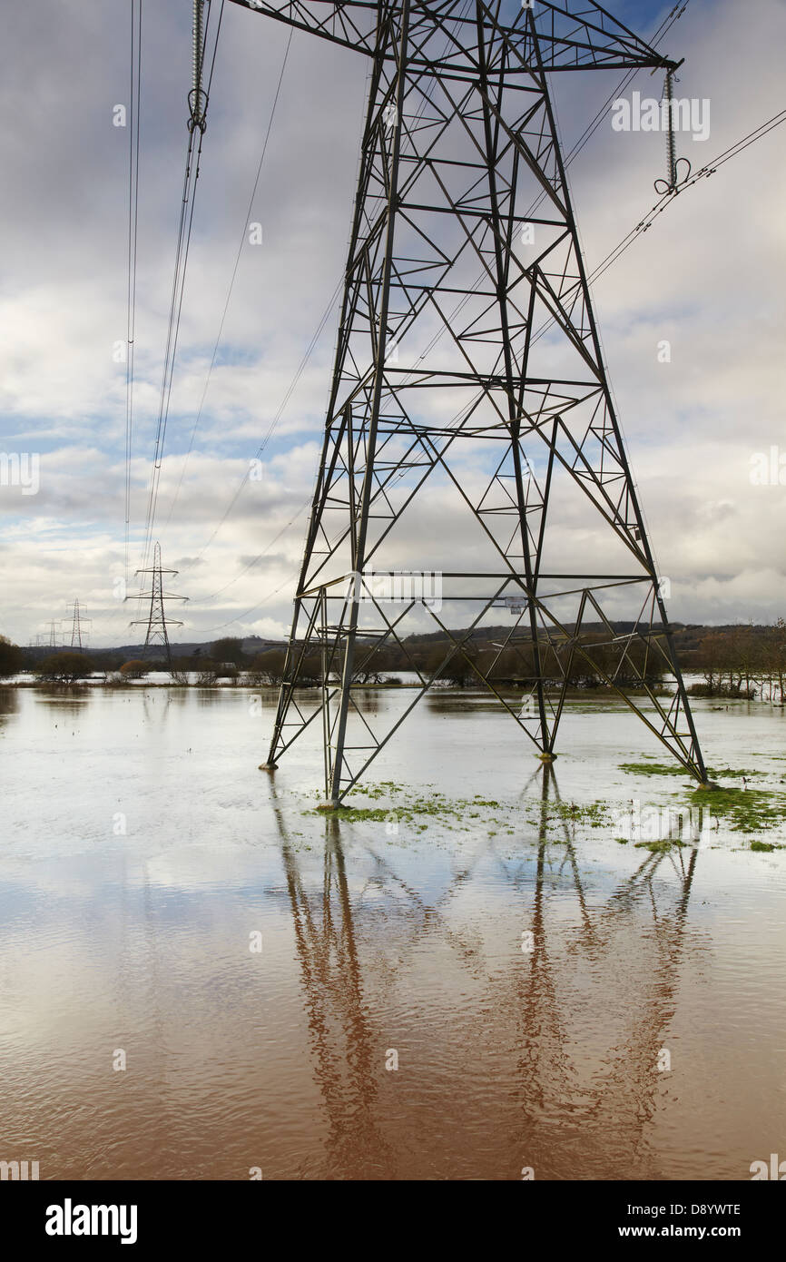 Electricity pylons standing flooded countryside in the valley of the ...