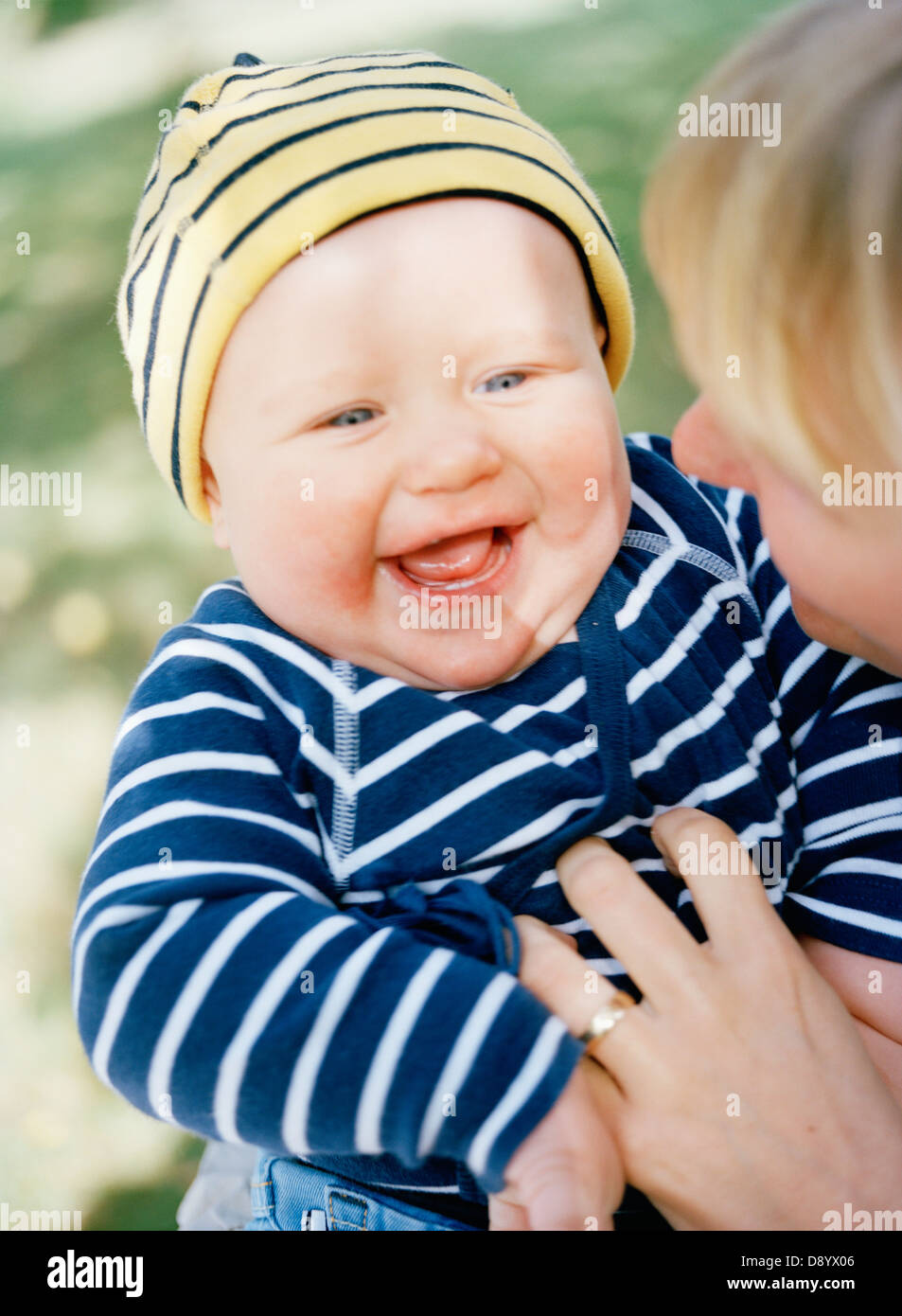 A smiling baby boy and his mother, Sweden Stock Photo - Alamy