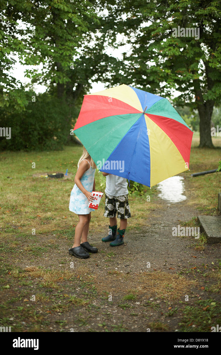 Children umbrella friendship friends hi-res stock photography and ...