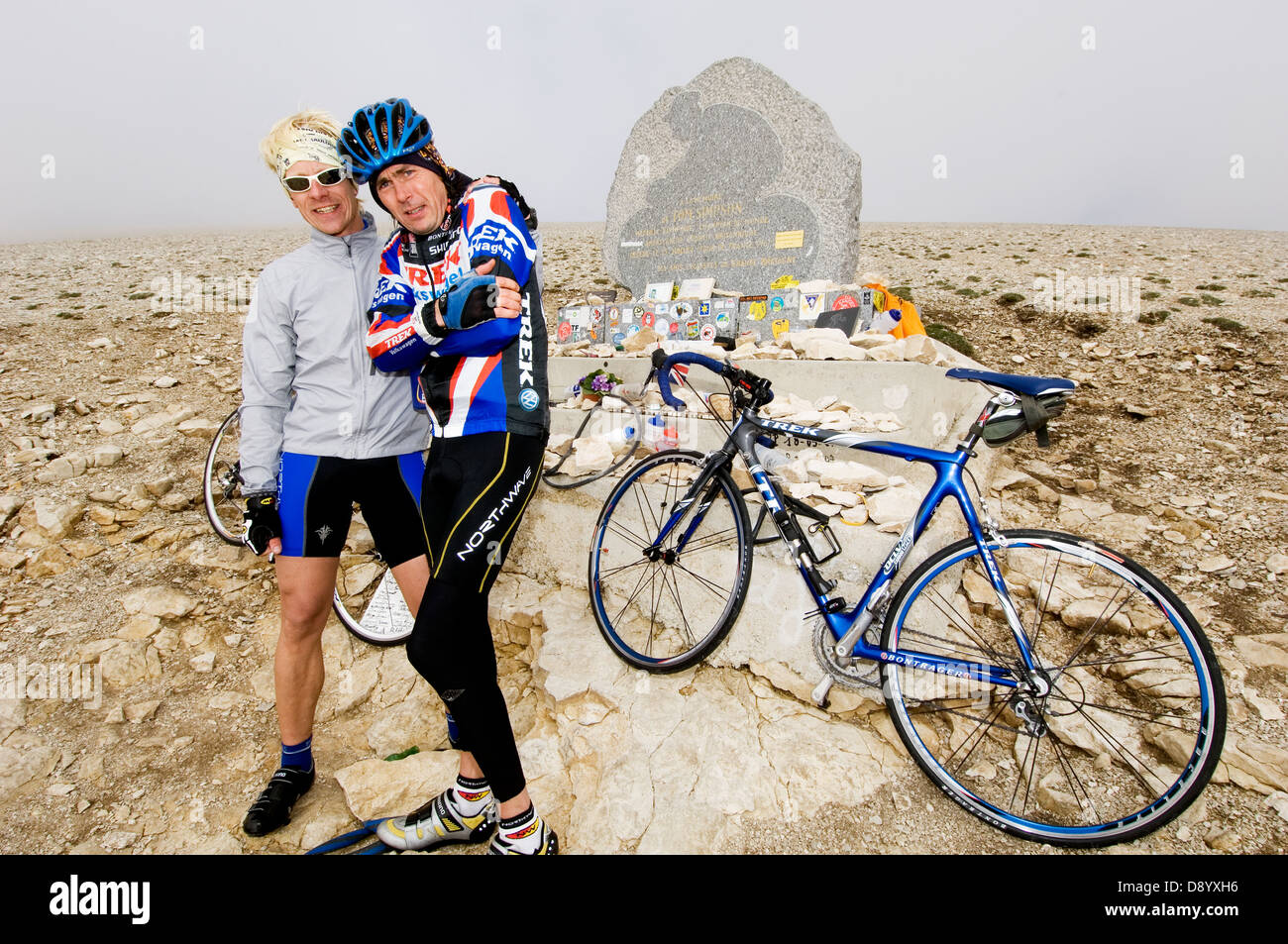 Portrait of cyclists by a grave on Mount Ventoux Stock Photo - Alamy