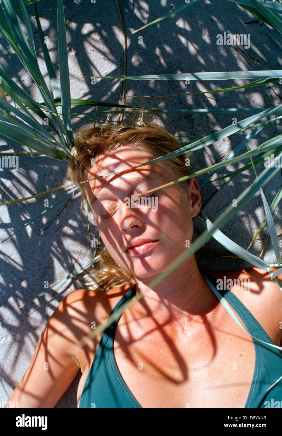 Woman sleeping bikini lying hi-res stock photography and images - Alamy