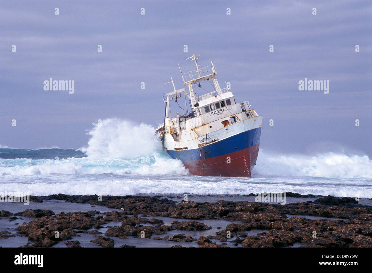 Ship run aground in water`s edge Stock Photo - Alamy